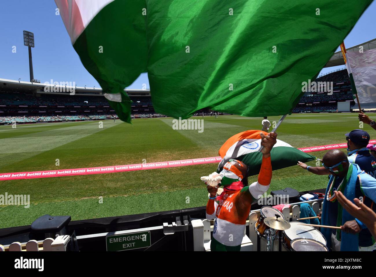 Fans cheering India wave their flags on day two of the Fourth Test ...