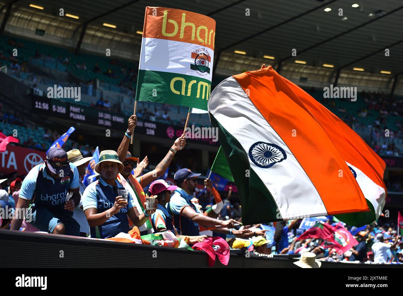 Fans cheering India wave their flags on day two of the Fourth Test ...
