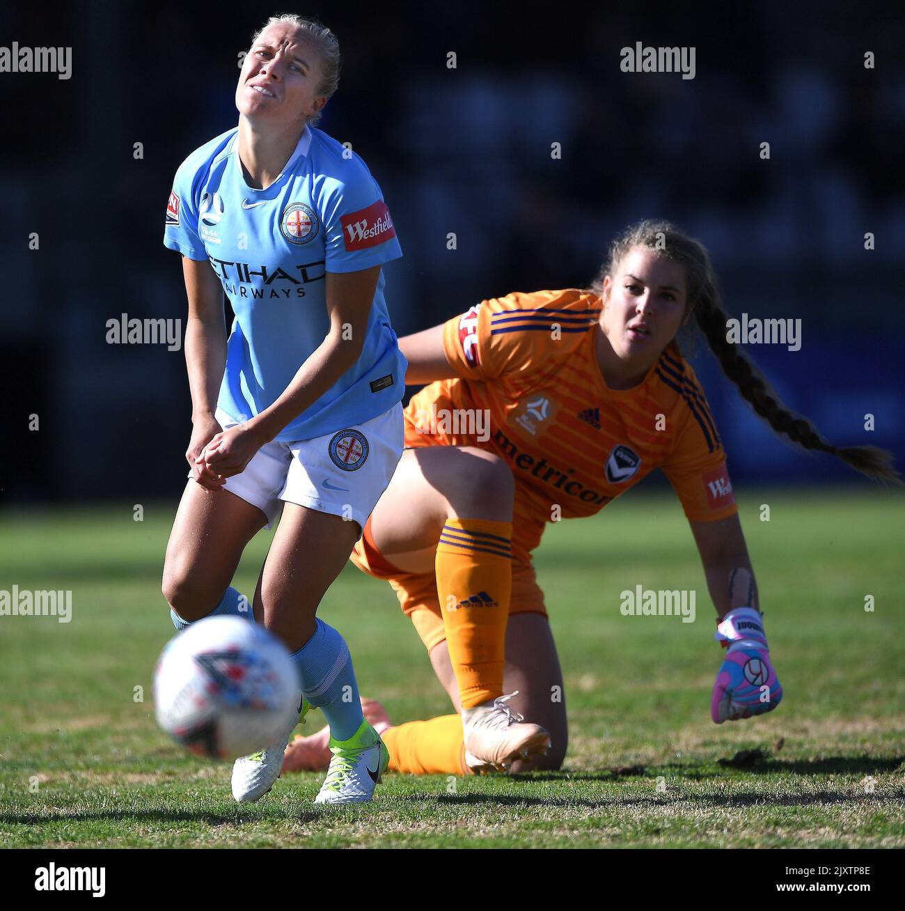 Goalkeeper Casey Dumont of Victory (right) prevents Tameka Butt of City ...