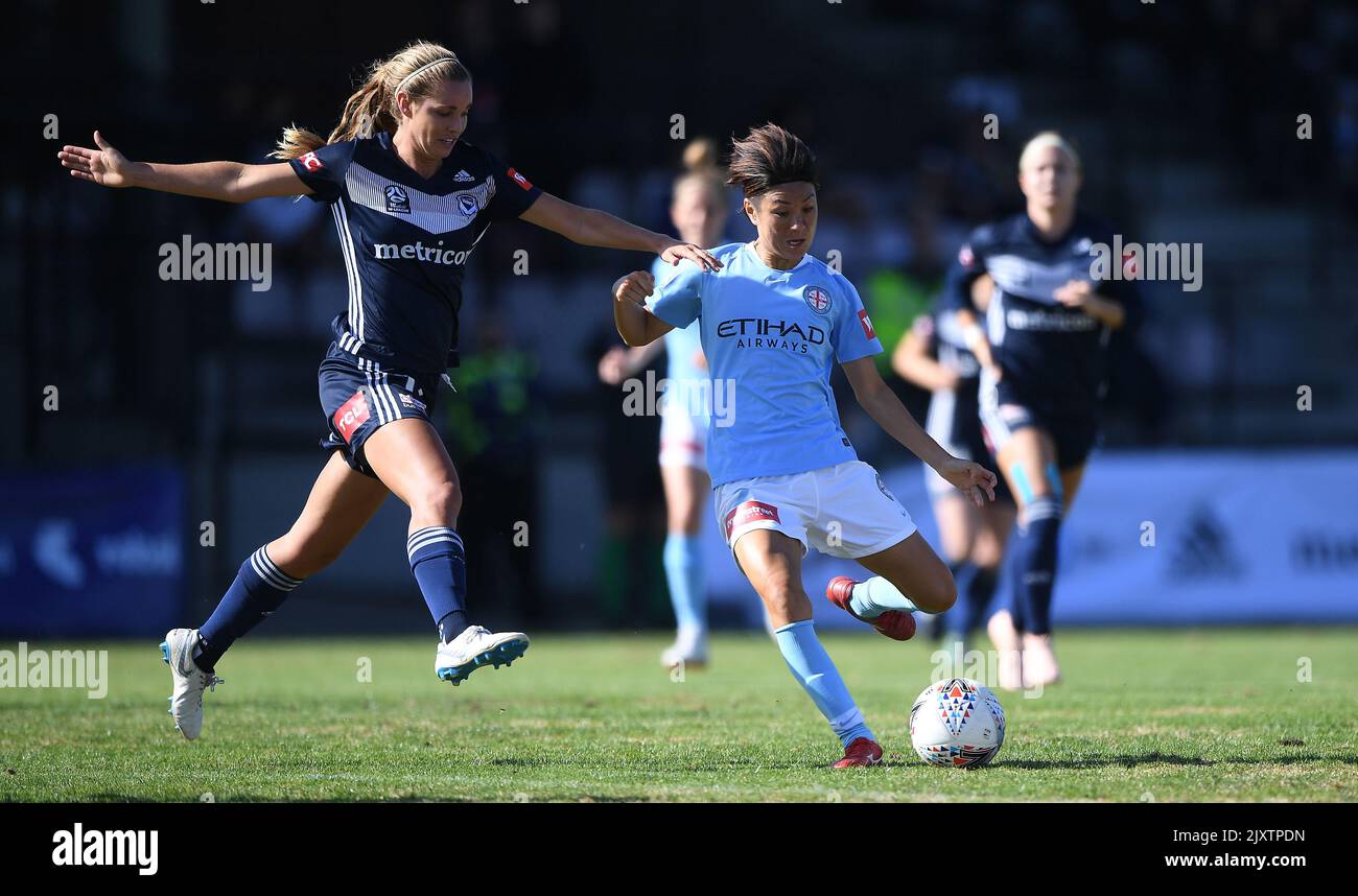 Yukari Kinga of City and Danielle Weatherholt of Victory contest during ...
