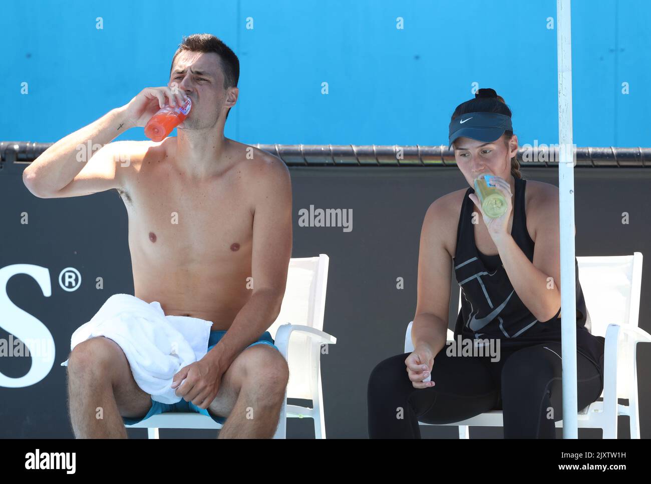 Bernard Tomic is seen with his sister Sara during a training session ...