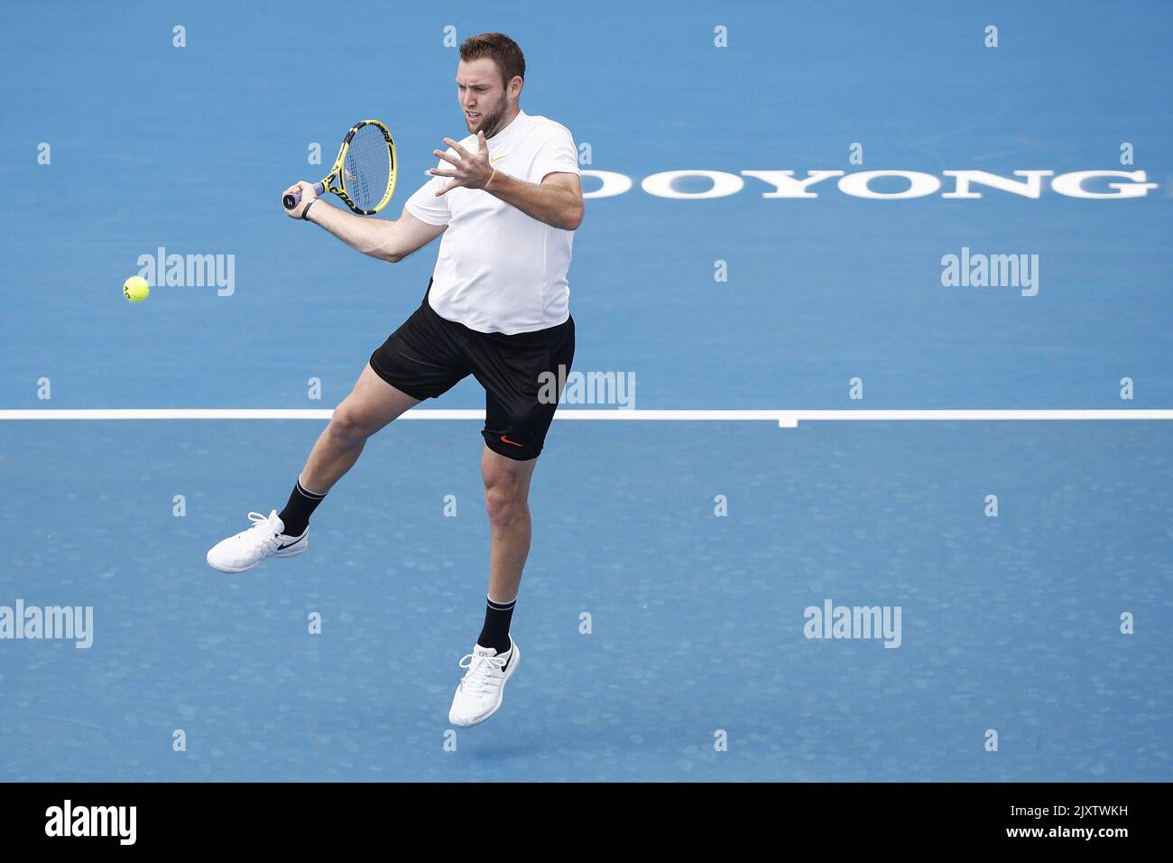 Jack Sock of the United States plays a forehand during match one of the ...