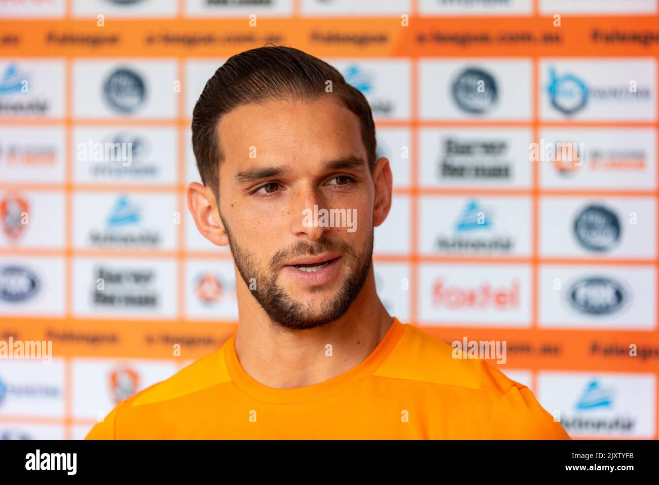 Jack Hingert of the Brisbane Roar is seen speaking to media before a ...