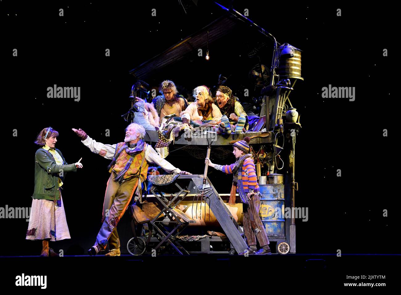 Tommy Blair as Charlie Bucket and Tony Sheldon as Grandpa Joe perform a ...