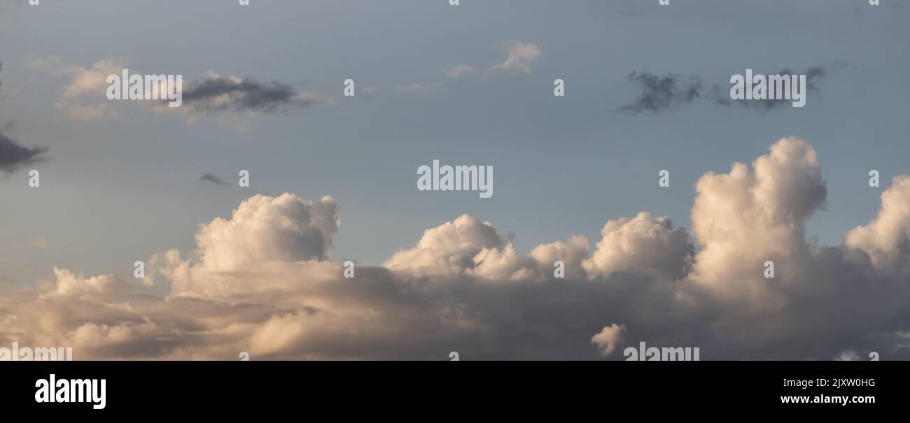 Puff Clouds in the Sky during sunset. Zoom in Stock Photo - Alamy