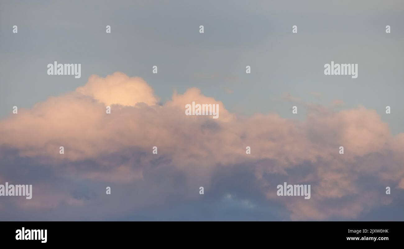 Puff Clouds in the Sky during sunset. Zoom in Stock Photo - Alamy