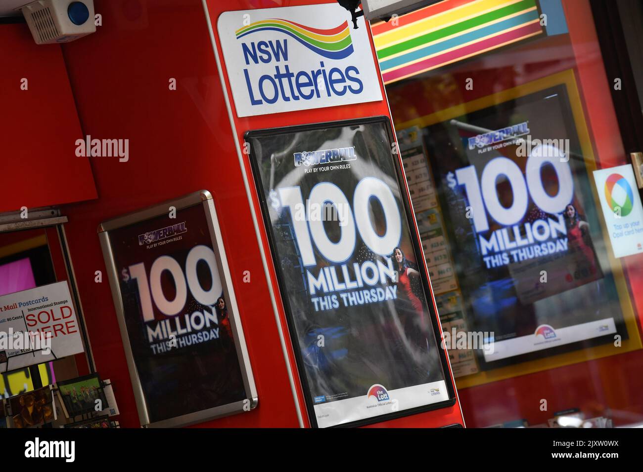 Signs advertising the NSW Lotteries $100 million Powerball outside a ...