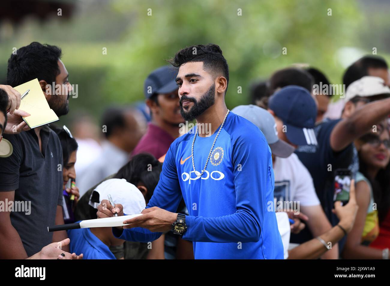 Mohammed Siraj of the Indian cricket team signs autographs following a ...