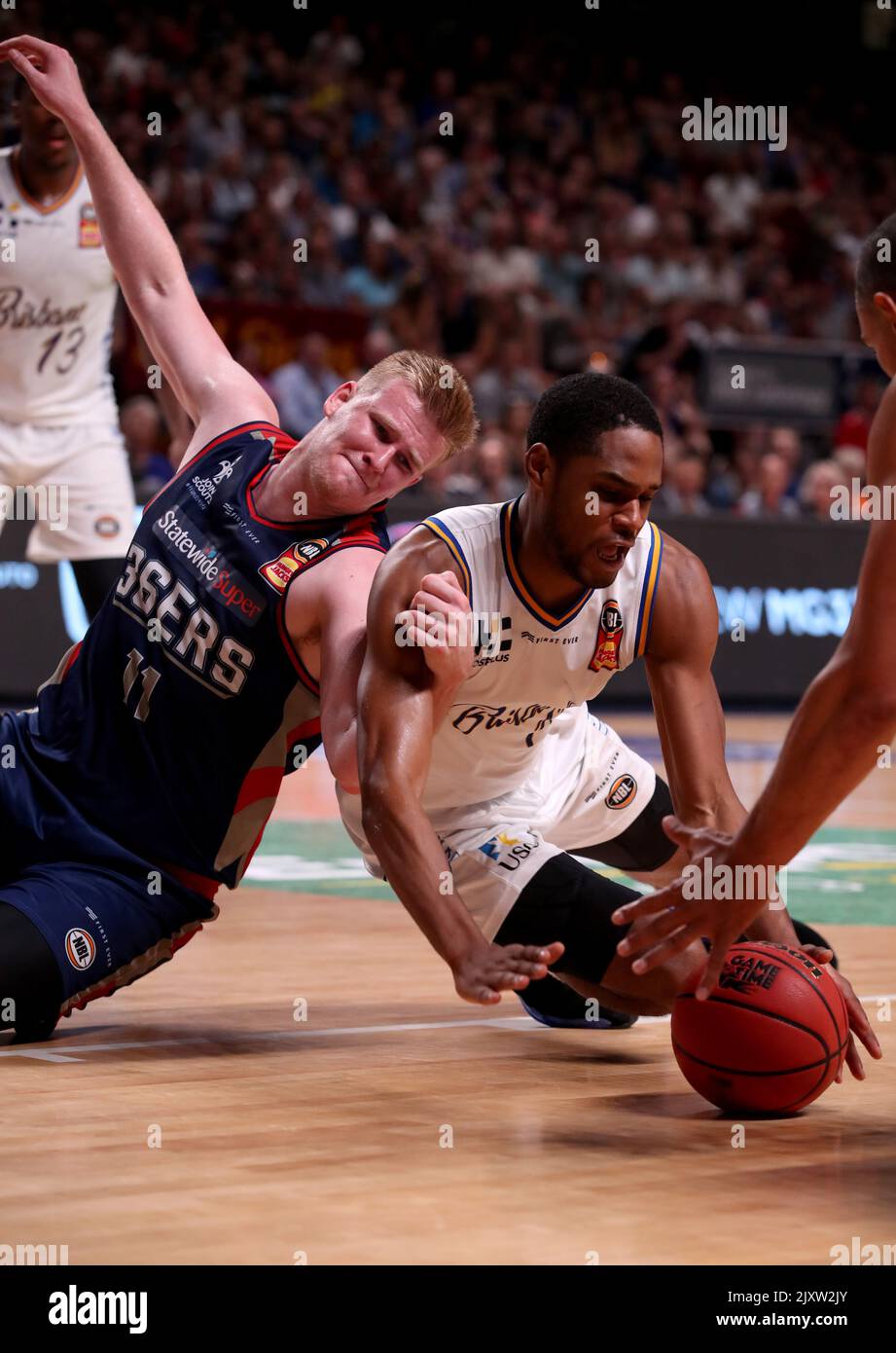 Harry Froling of the Sixers and Aj Davis of the Bullets during the ...