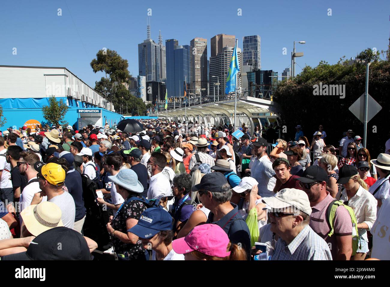 Fans queue at the entrance ahead of the round one matches on day one of ...