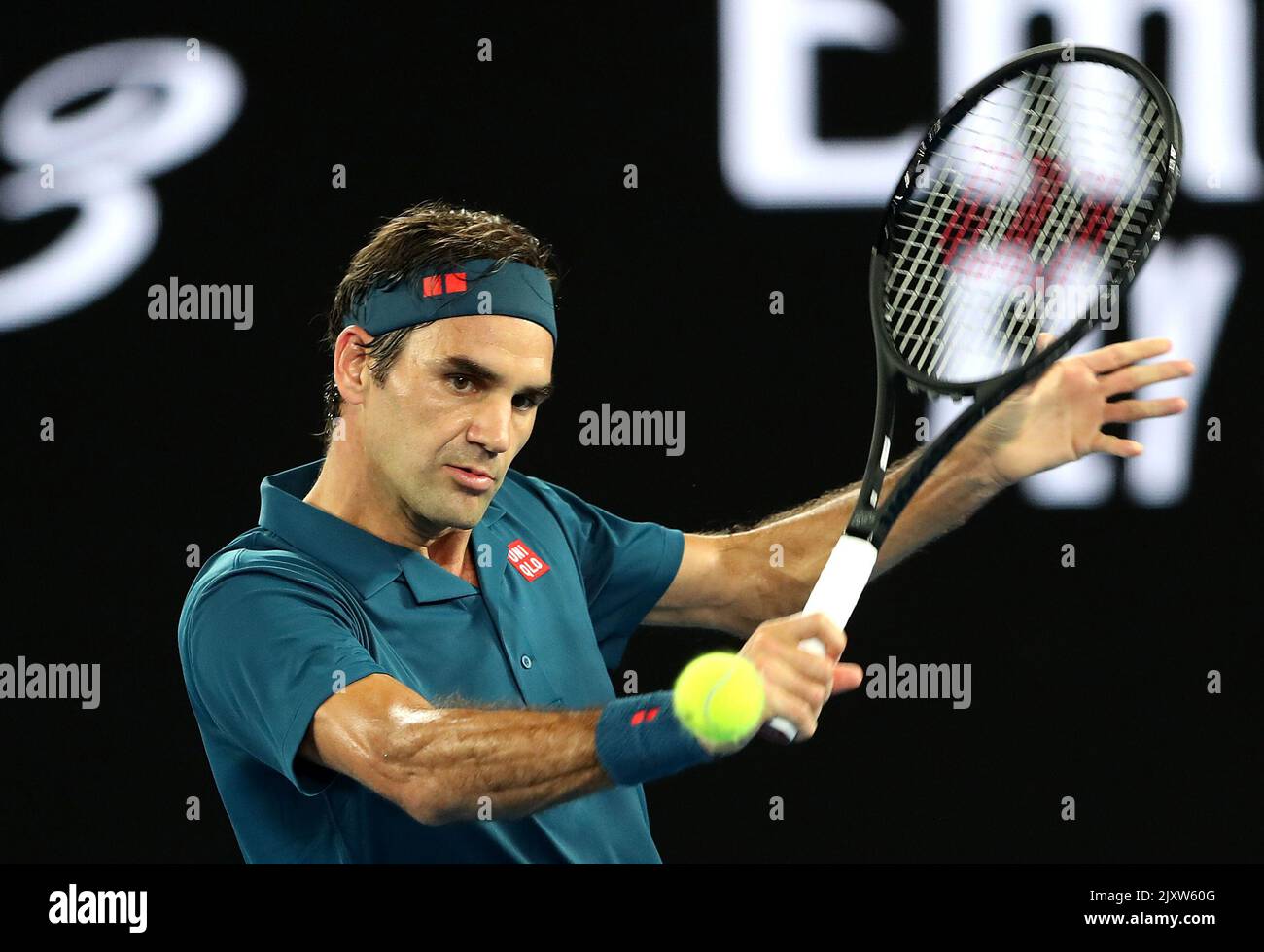 Roger Federer of Switzerlan in action against Denis Istomin of ...