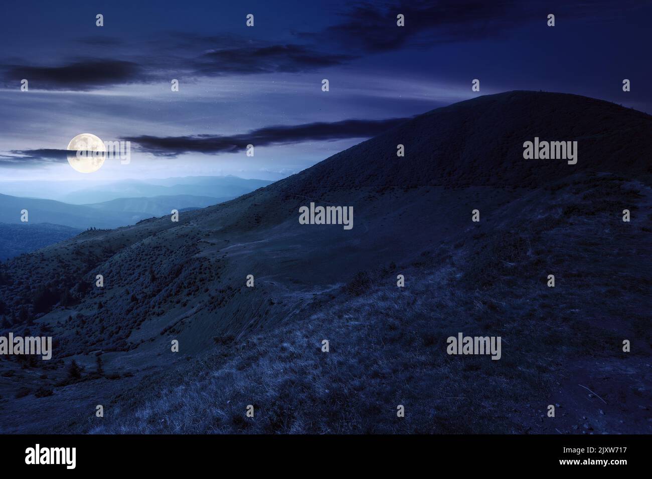 view in to the mountain valley at night. beautiful summer landscape of ...