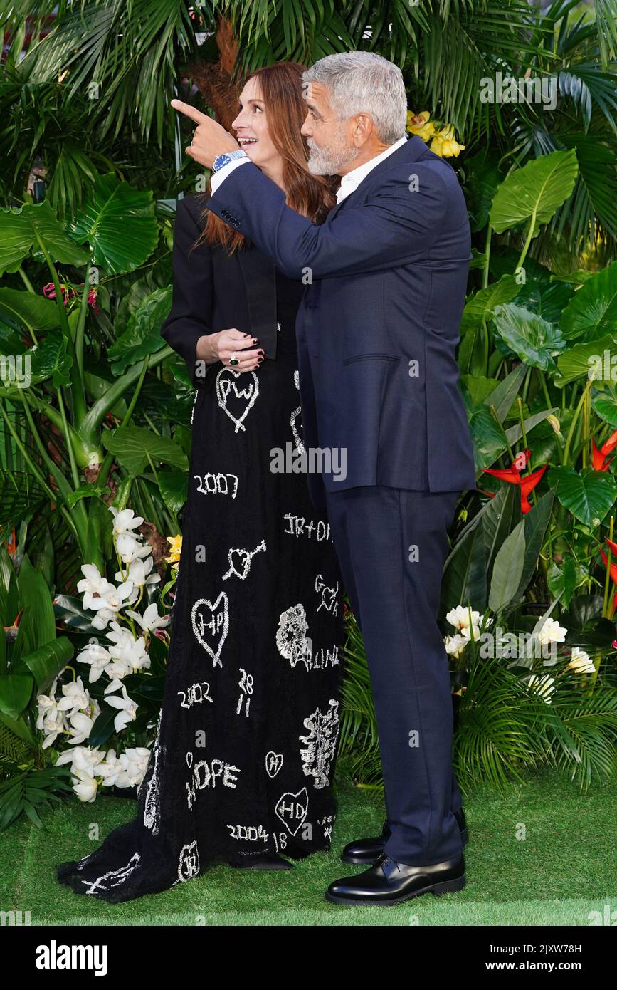 Julia Roberts and George Clooney (right) attend the world premiere of Ticket to Paradise at ...