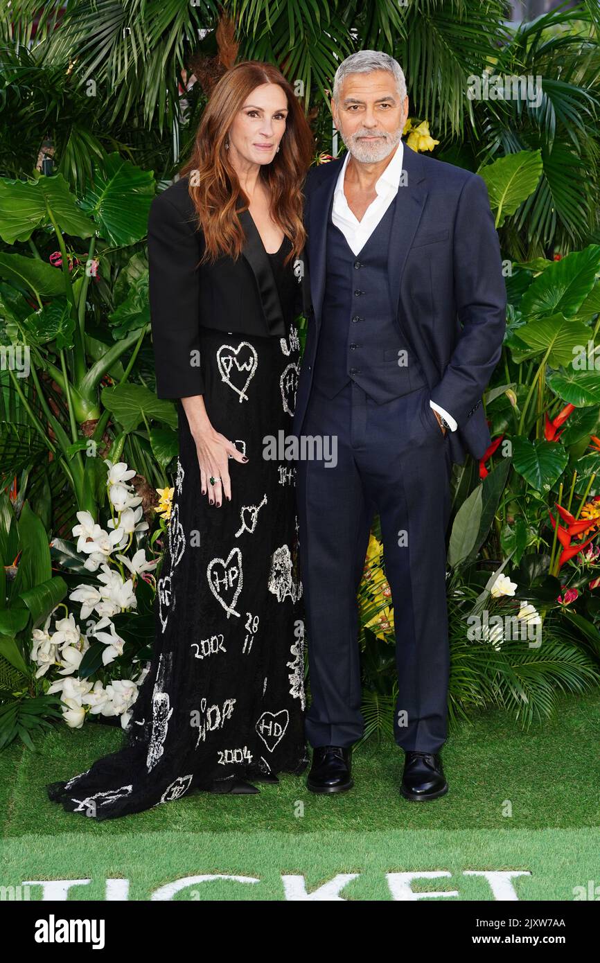 Julia Roberts and George Clooney (right) attend the world premiere of Ticket to Paradise at ...