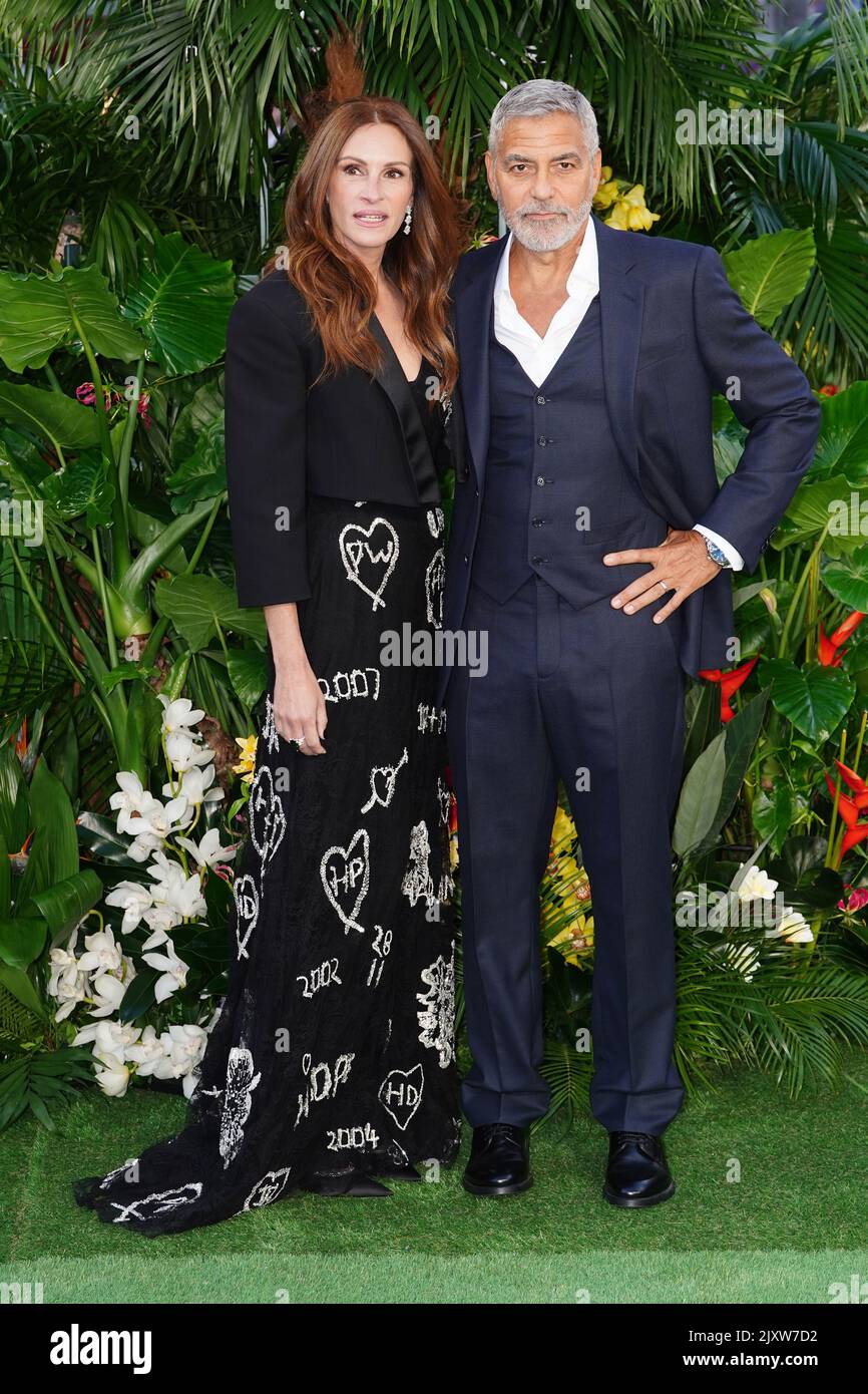 Julia Roberts and George Clooney (right) attend the world premiere of Ticket to Paradise at ...