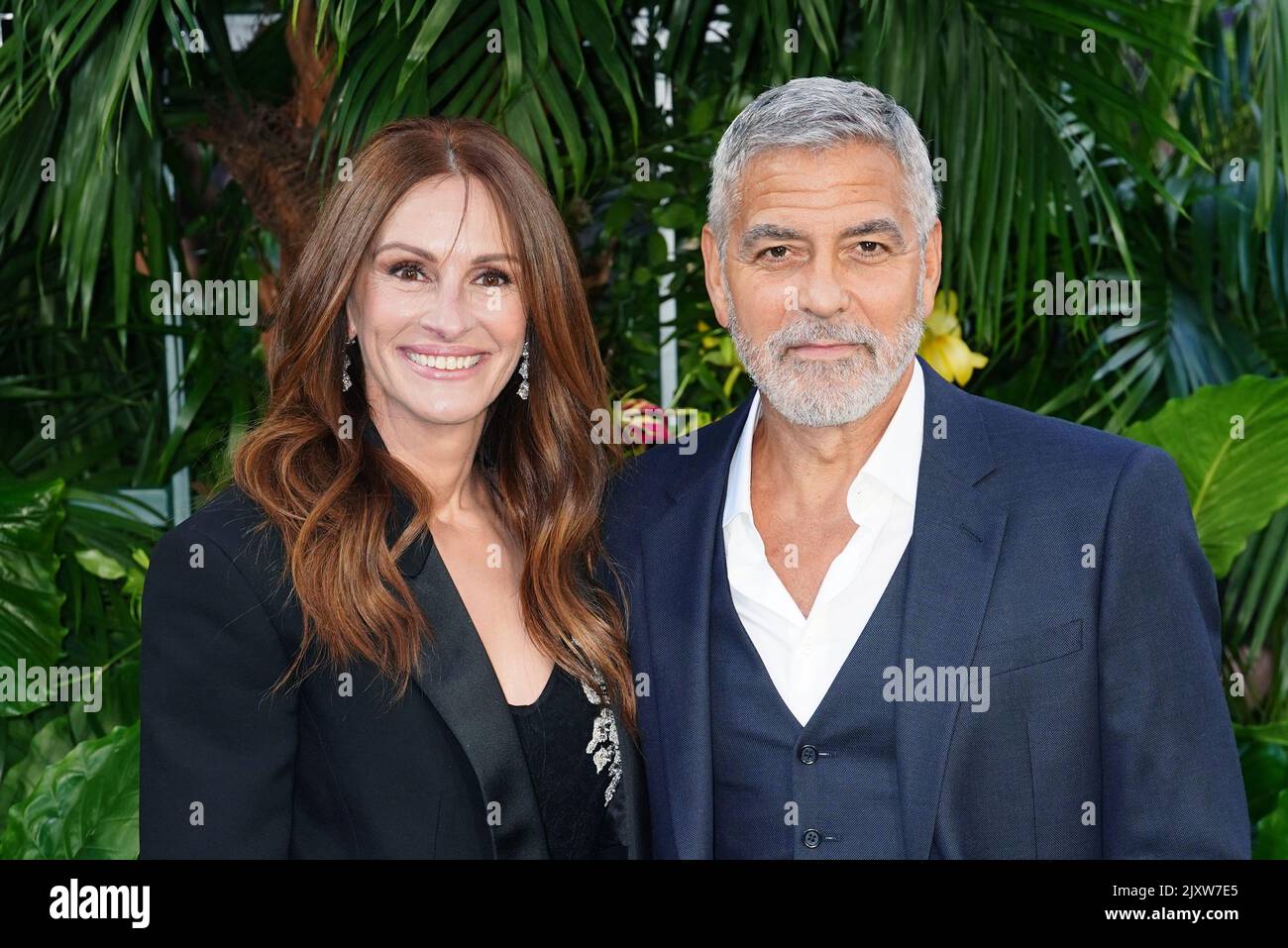 Julia Roberts and George Clooney (right) attend the world premiere of Ticket to Paradise at ...