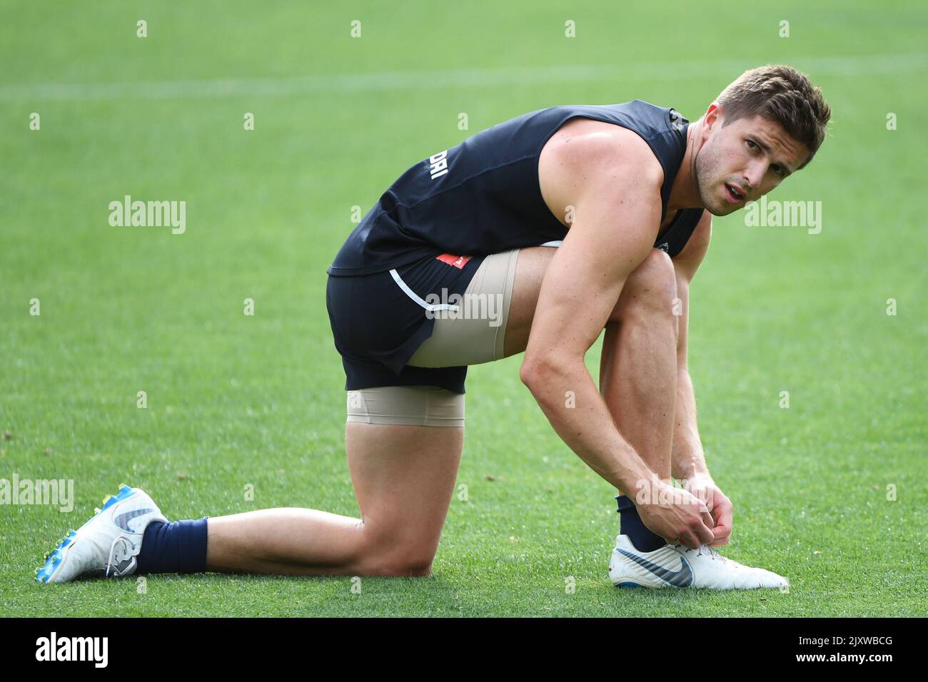 Marc Murphy ties his boot up during the Carlton football club's team ...