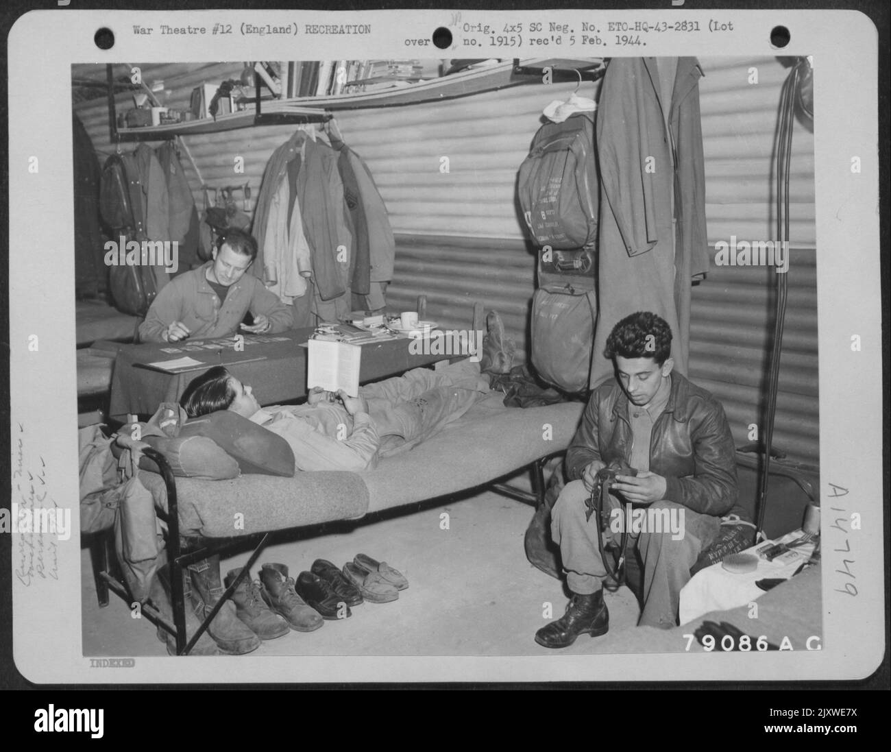 Relaxing In The Quarters Are These Members Of A Liberator Crew Named ...