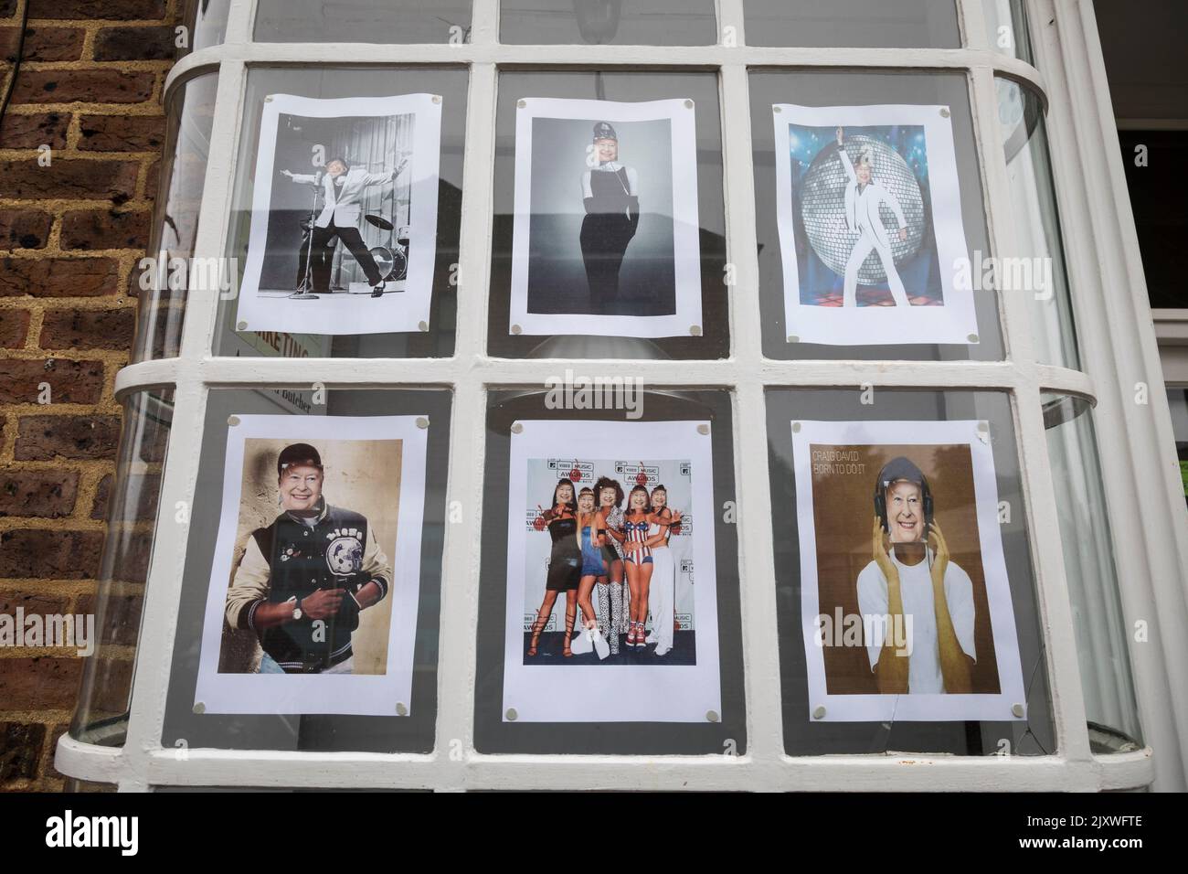 Shop window displaying humorous images of the Queen in celebration of ...