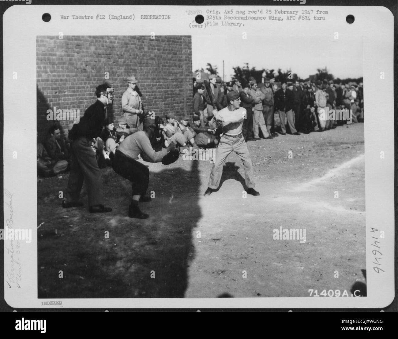 The Umpire Stands Ready To Make The Call; The Catcher Is In Position ...