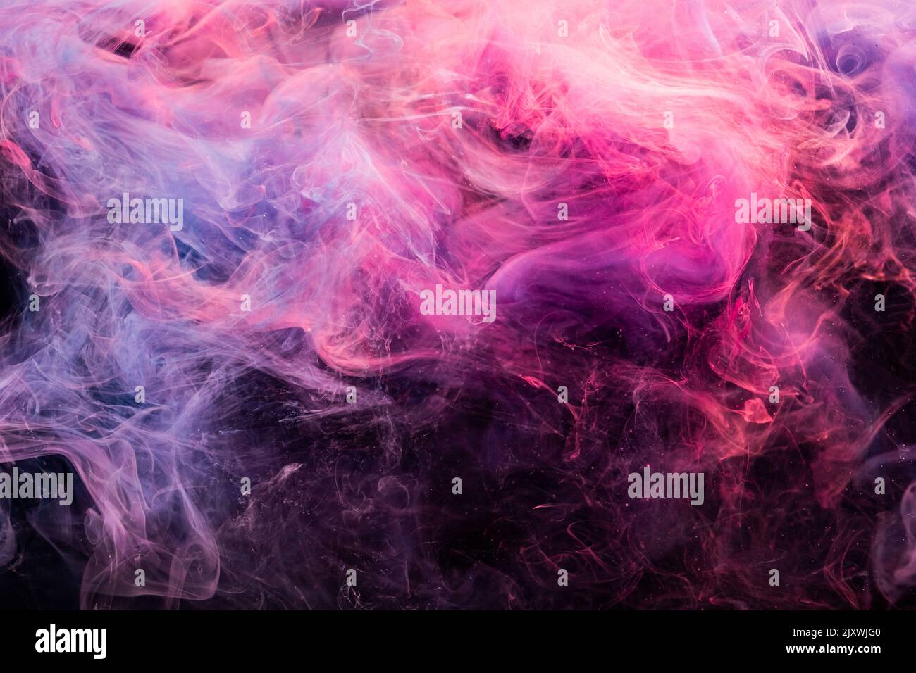 ink in water colorful background pink violet fog Stock Photo - Alamy