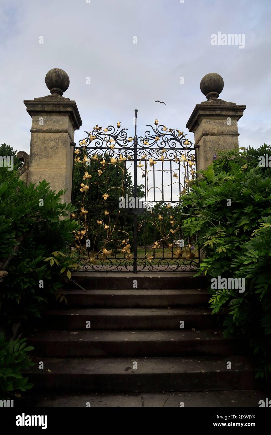 Ornamental iron gates with gold and black featres. St Fagans National ...