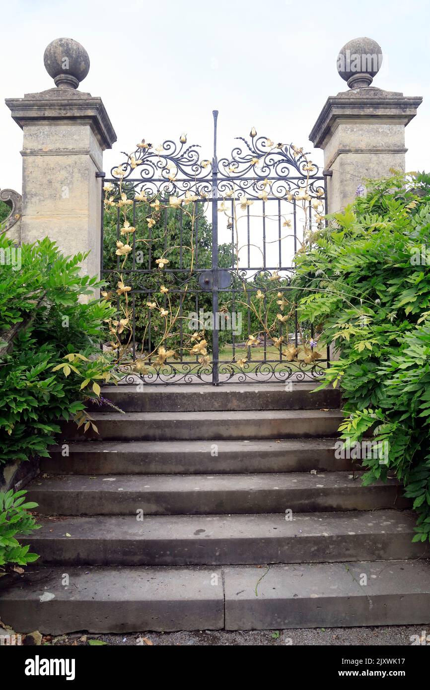 Ornamental iron gates with gold and black featres. St Fagans National ...