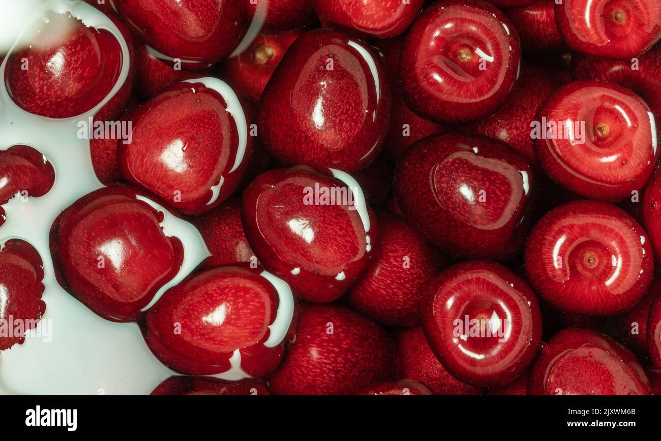 Red juicy sweet cherries. Juicy maroon fruit close-up. Cherries in ...