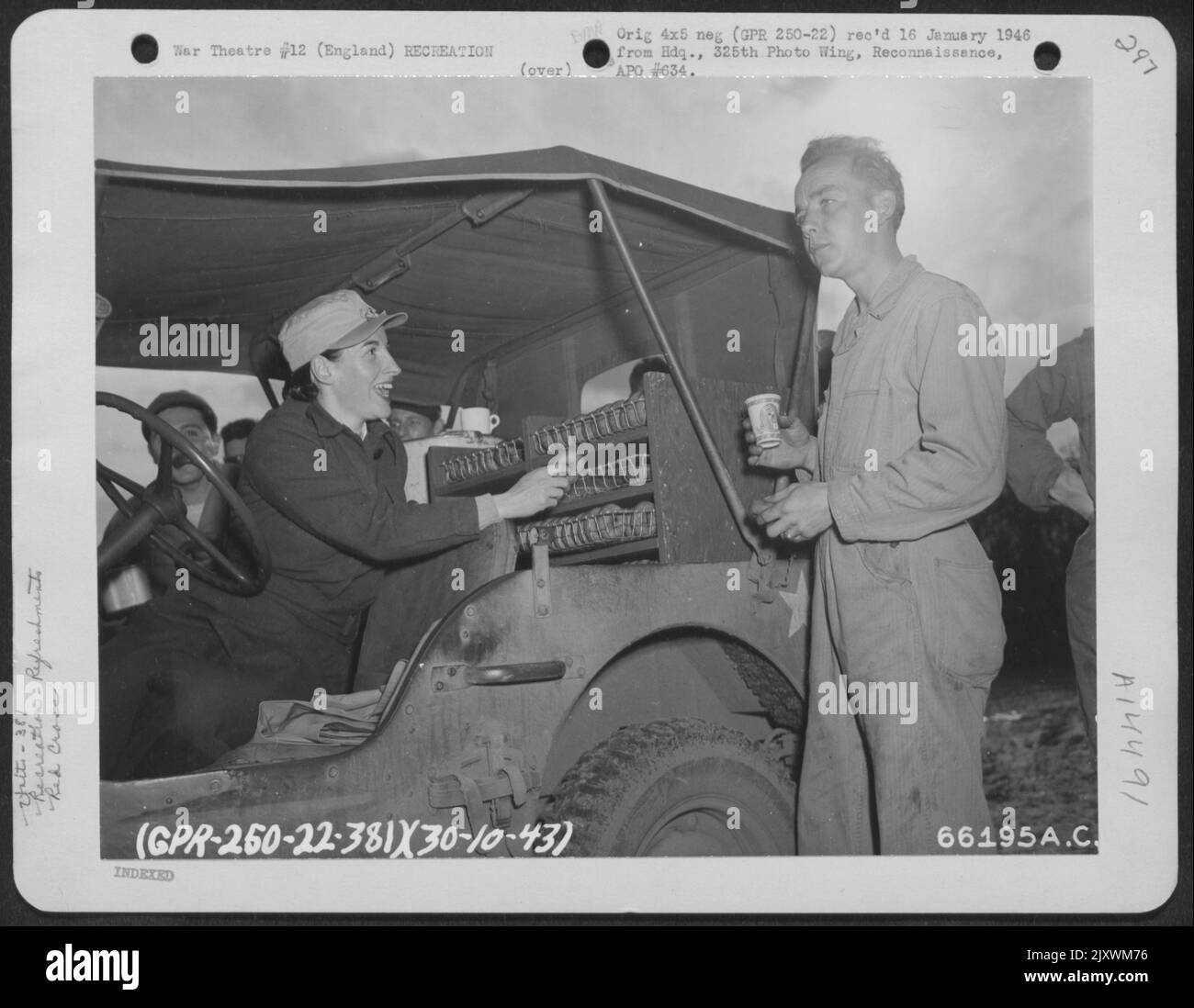 Red Cross Worker Hands Out Doughnuts To Some Of The Men Of The 381St ...