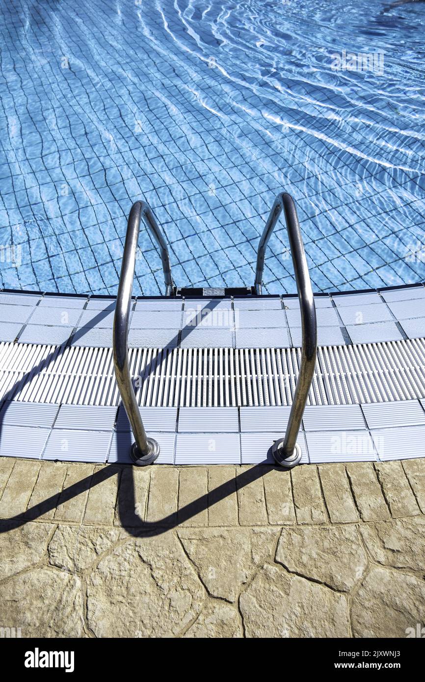 Detail of access to an outdoor swimming pool, sports and holidays Stock ...
