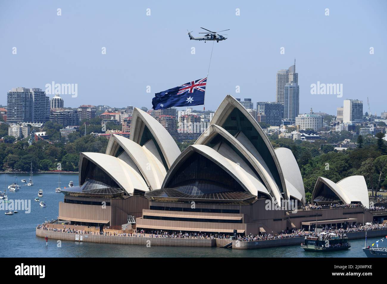 A Royal Australian Navy MH-60R Seahawk helicopter flies an Australian ...
