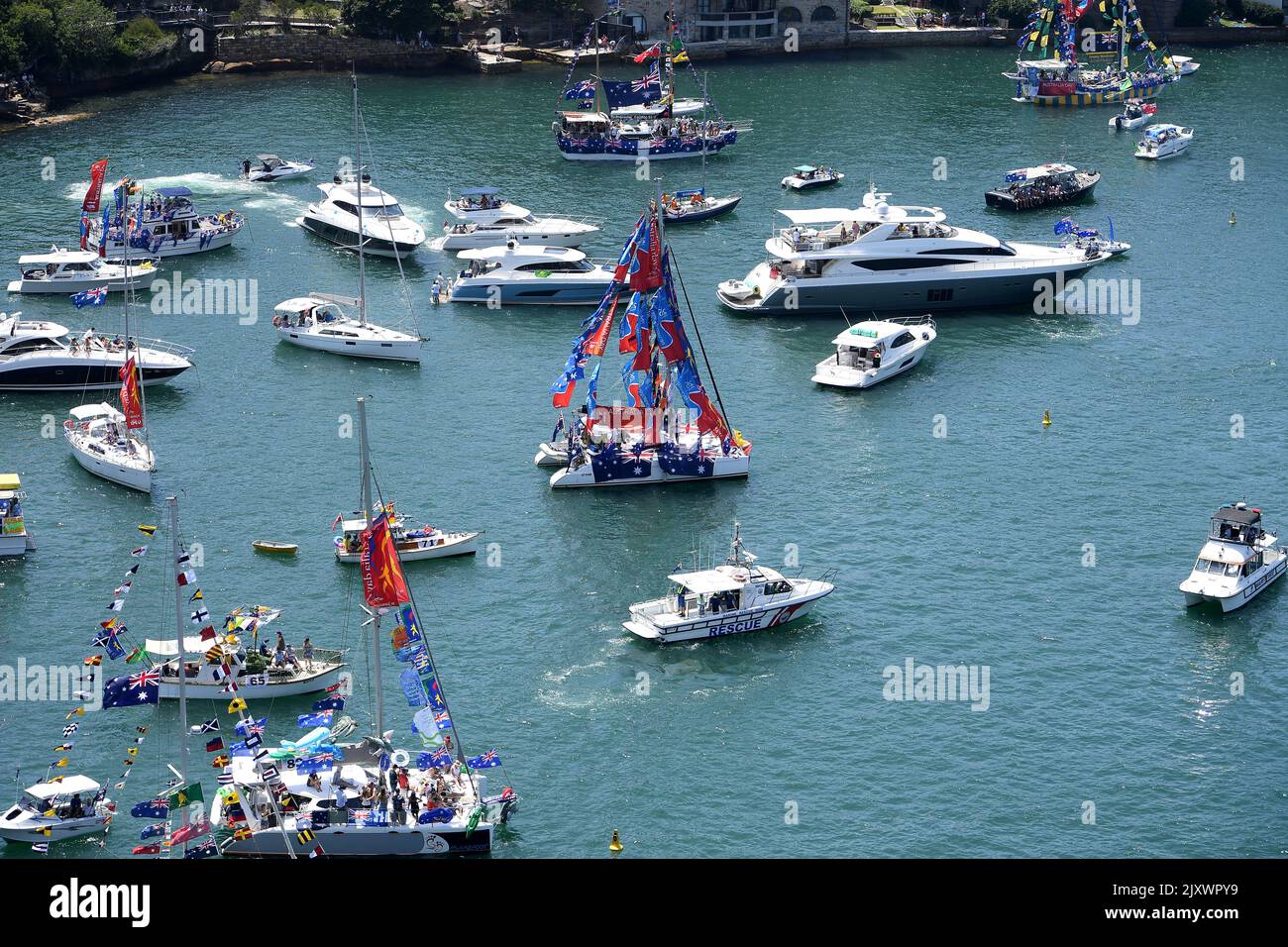Spectator craft are seen on Sydney Harbour during Australia Day ...
