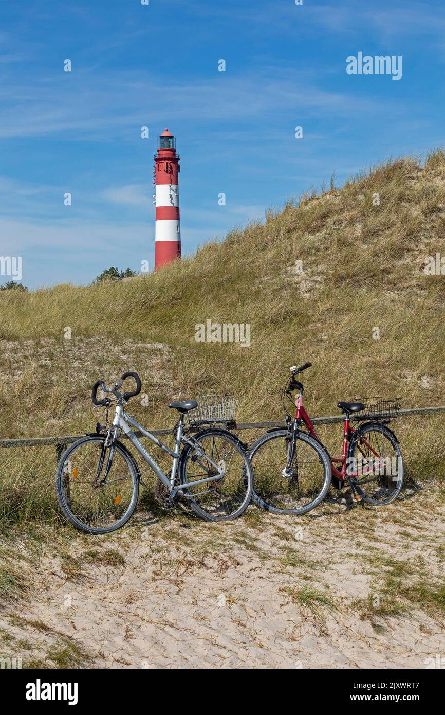 parked bicycles, dunes, lighthouse, Amrum Island, North Friesland ...