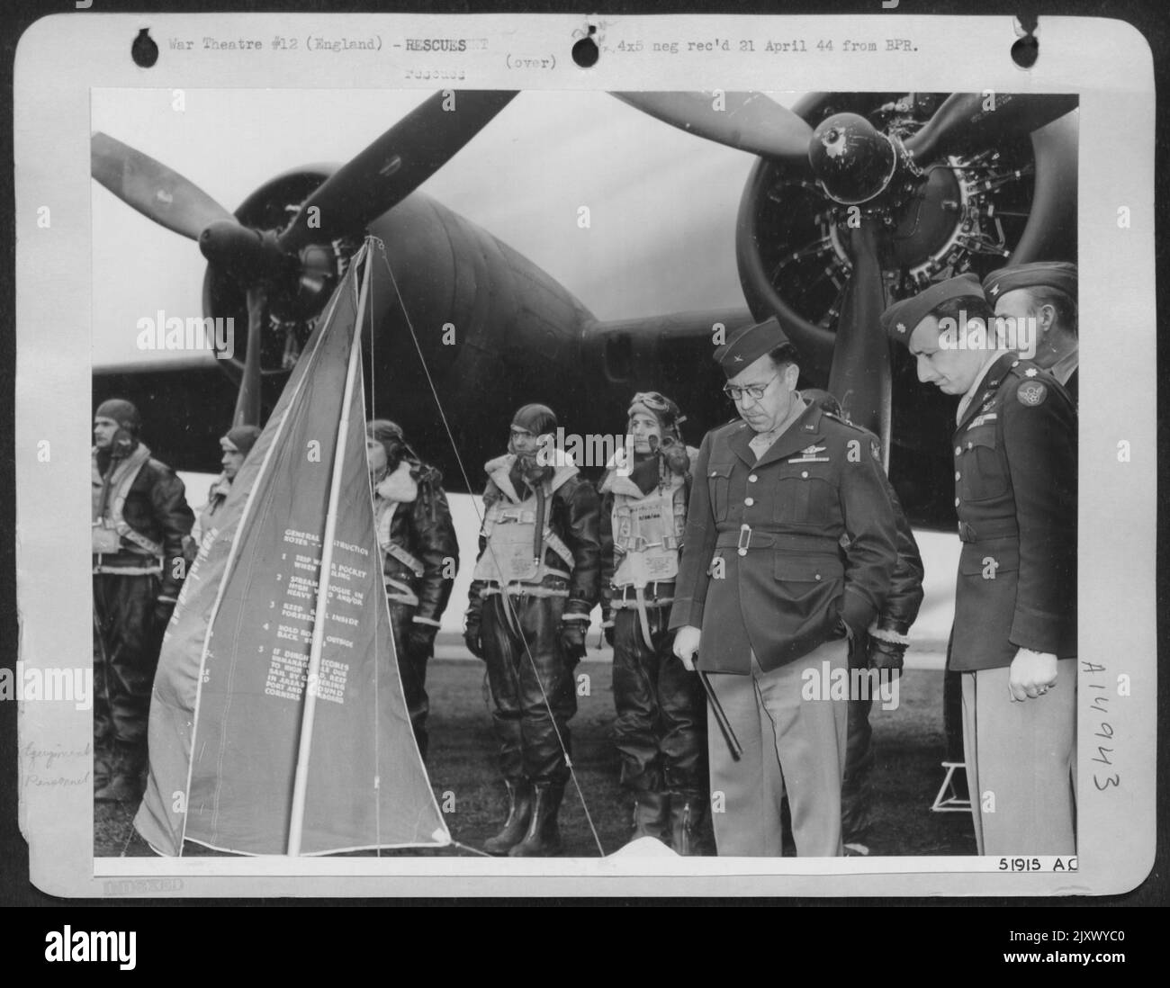 Gen. Williams looks over dinghy with sail up which was on display as ...