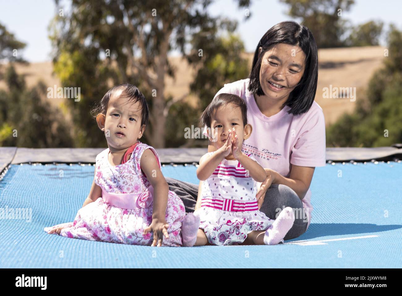 Bhumchu Zangmo poses for a photograph with her twins Nima (left) and ...