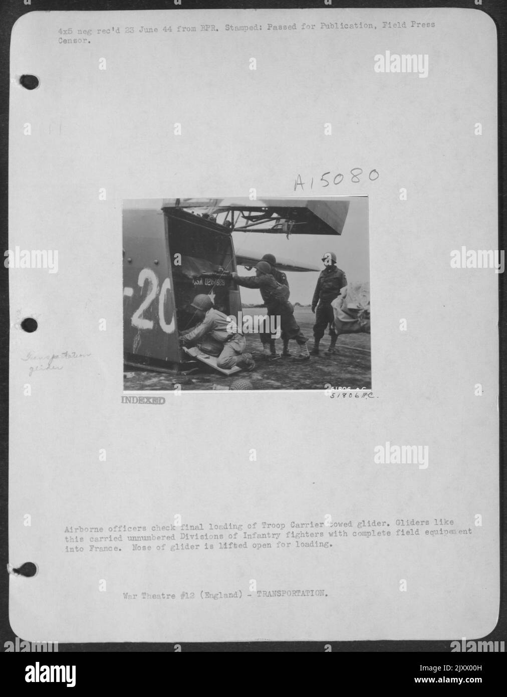 Airborne officers check final loading of Troop Carrier towed glider ...