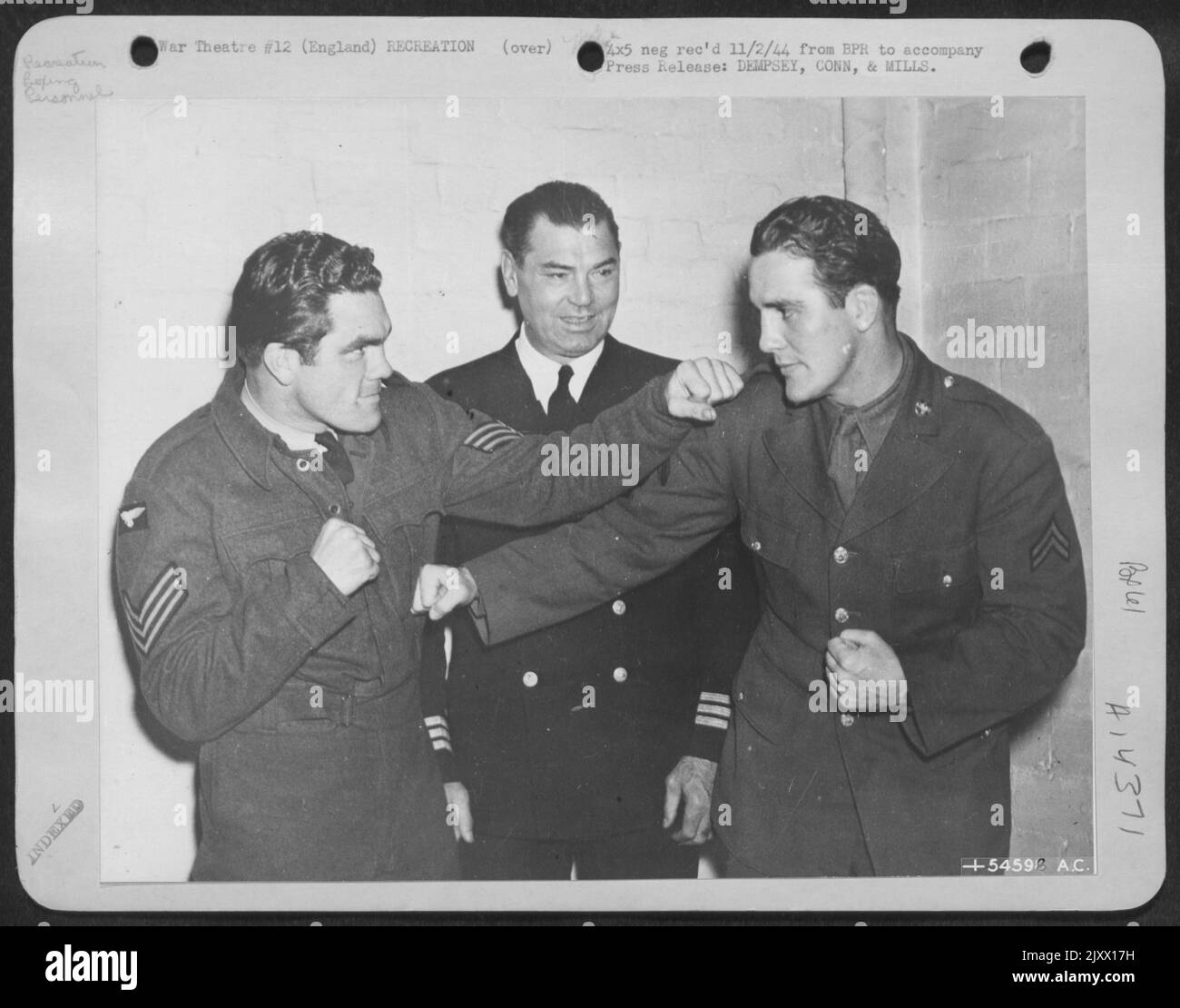 Commander Jack Dempsey of the U.S. Coast Guard, center, gives the nod ...