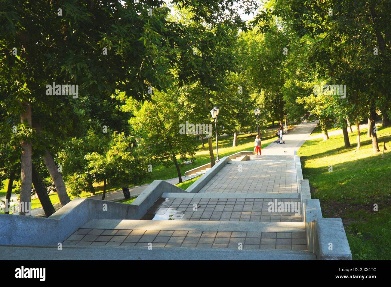 Samara, Russia - circa March, 2022: People in the summer park walk ...