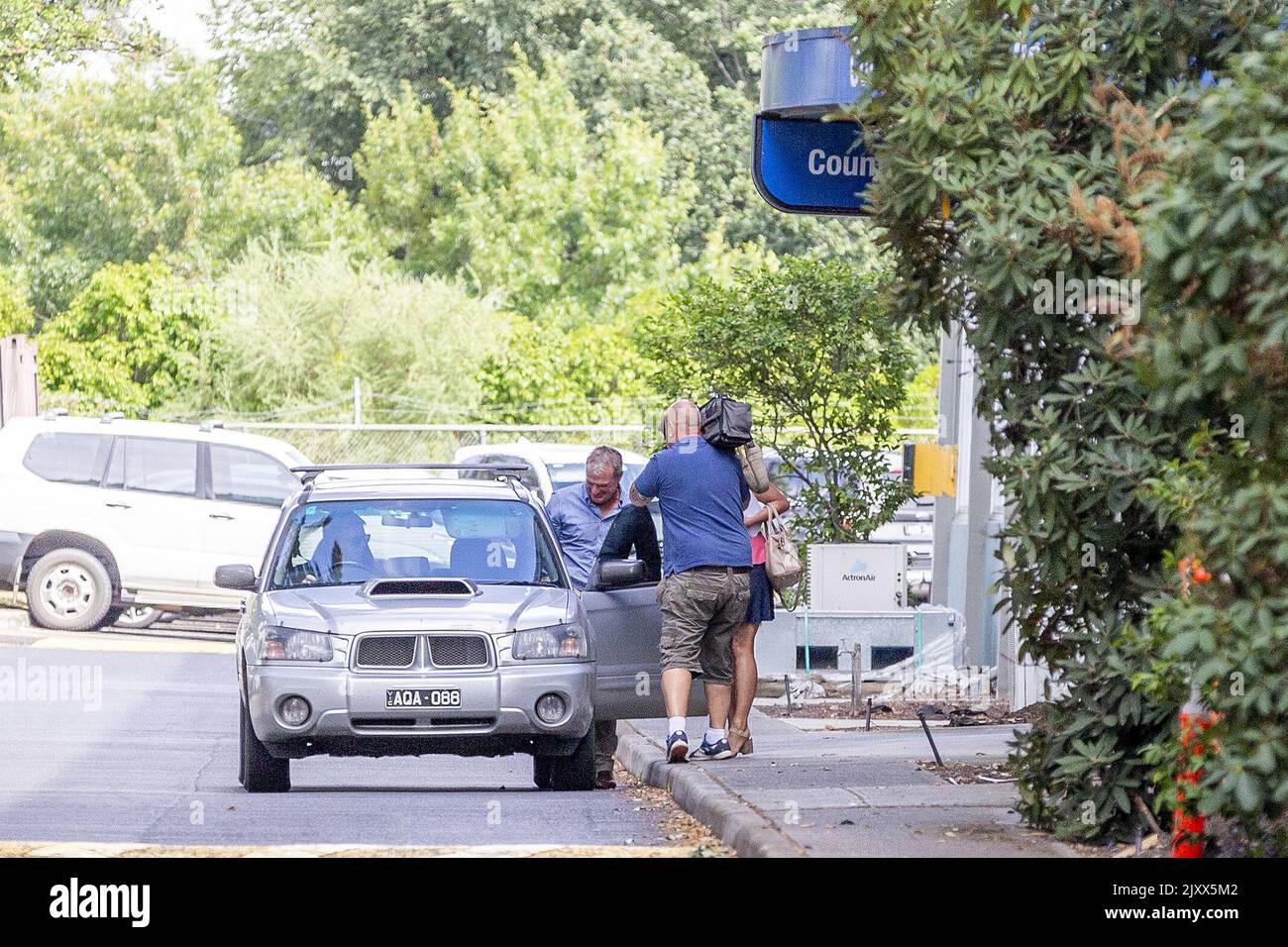 Darren Weir (centre) is seen getting into a car and leaving Victorian ...