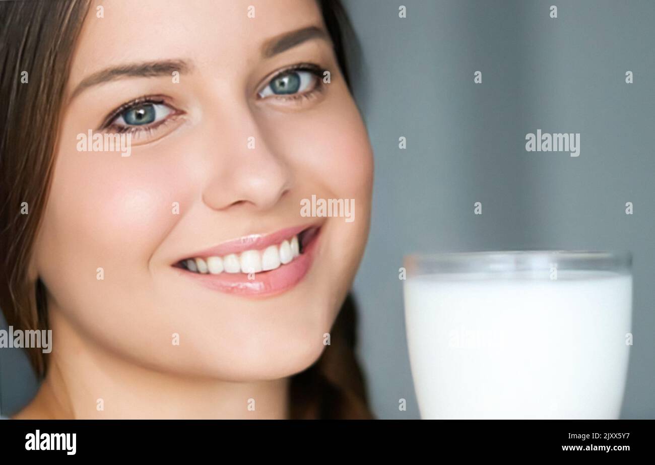 Diet and wellness, young woman with glass of milk or protein shake ...