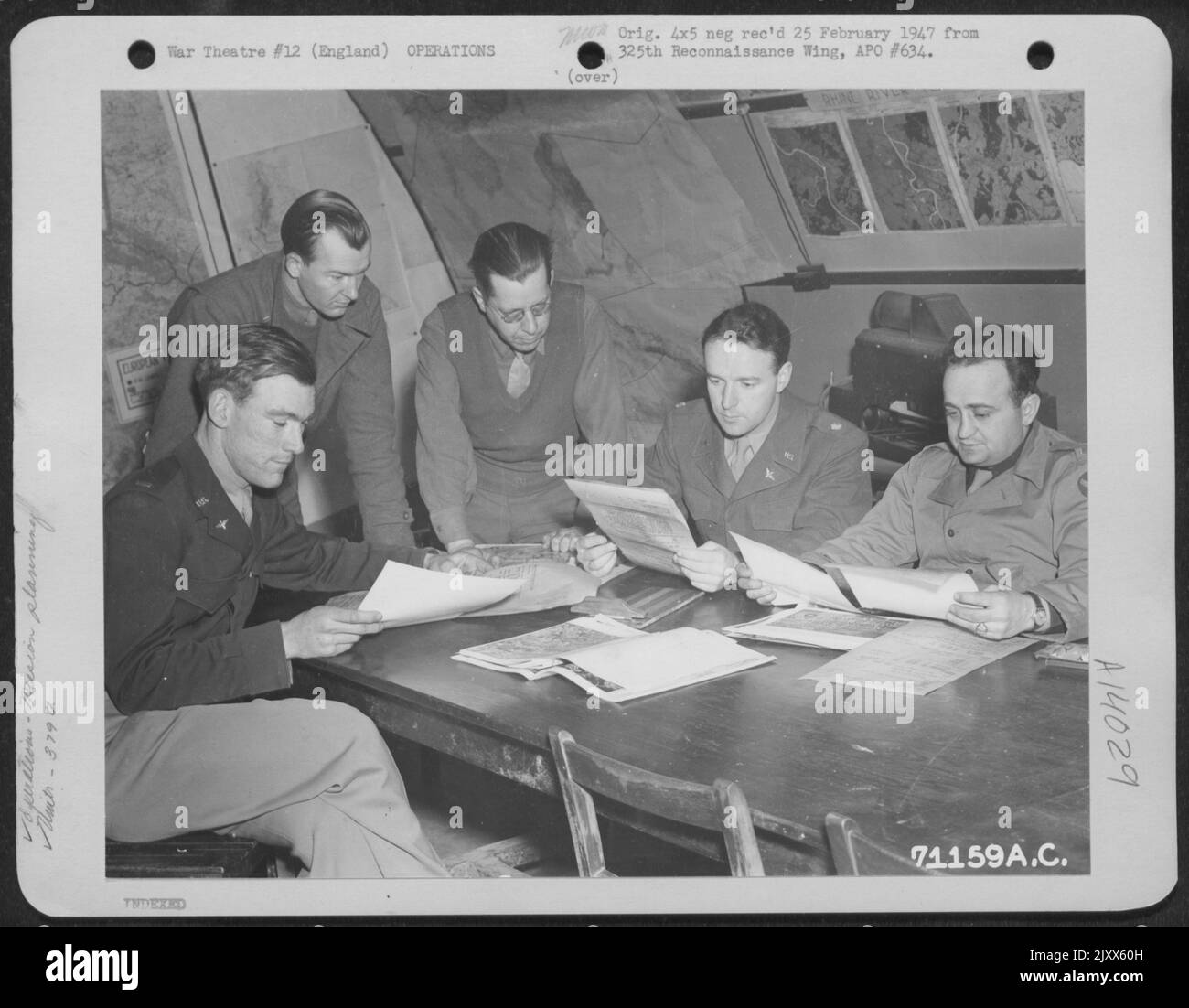 Office Of The 379Th Bomb Group Study Aerial Photographs Of The Target ...