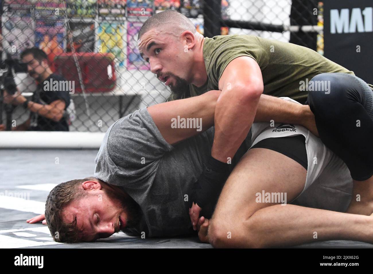 Robert Whittaker (right) in action at a UFC 234 card open training ...