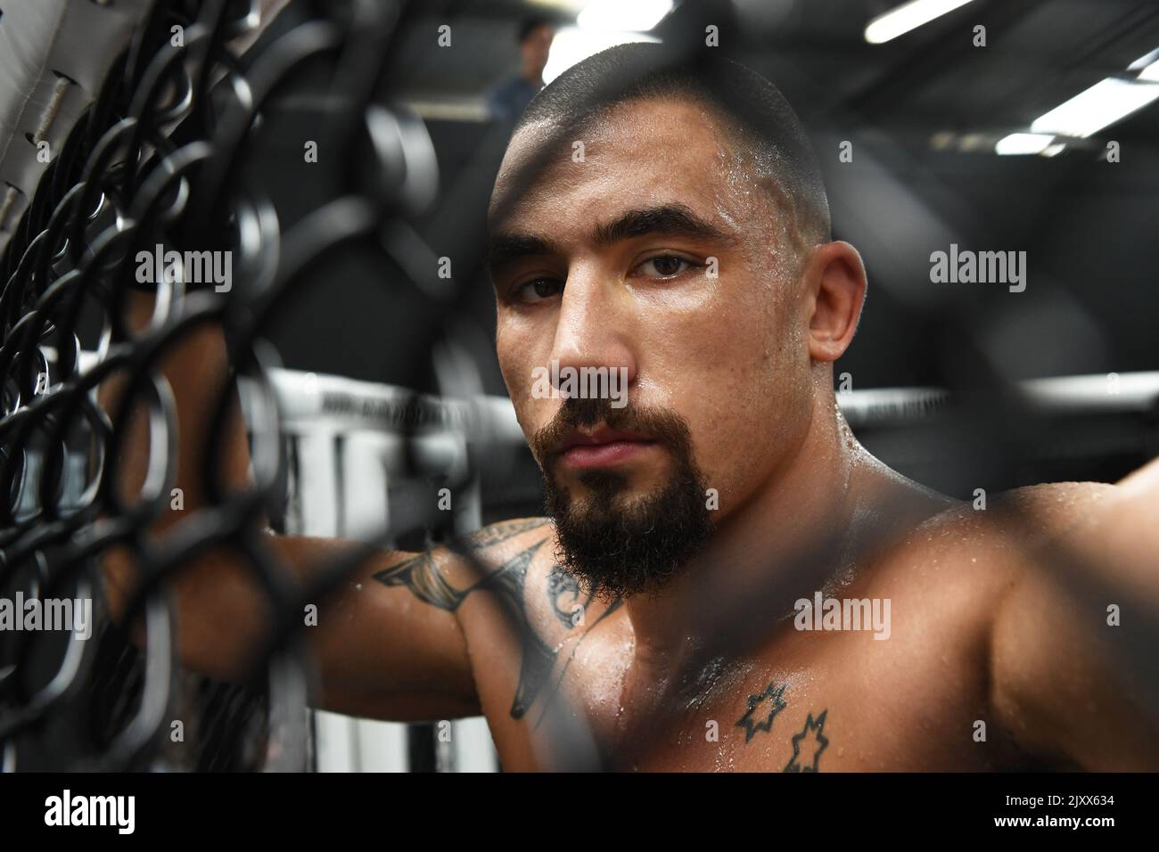 Robert Whittaker poses for a photograph following the UFC 234 card open ...