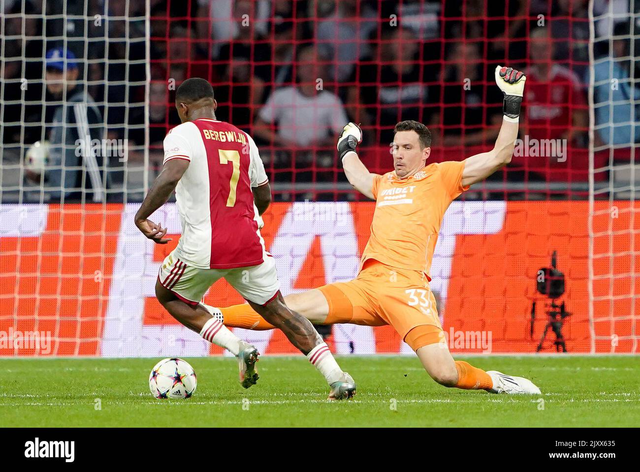 Ajax’s Steven Bergwijn takes the ball around Rangers goalkeeper Jon ...