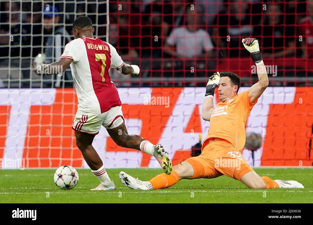 Ajax’s Steven Bergwijn takes the ball around Rangers goalkeeper Jon ...