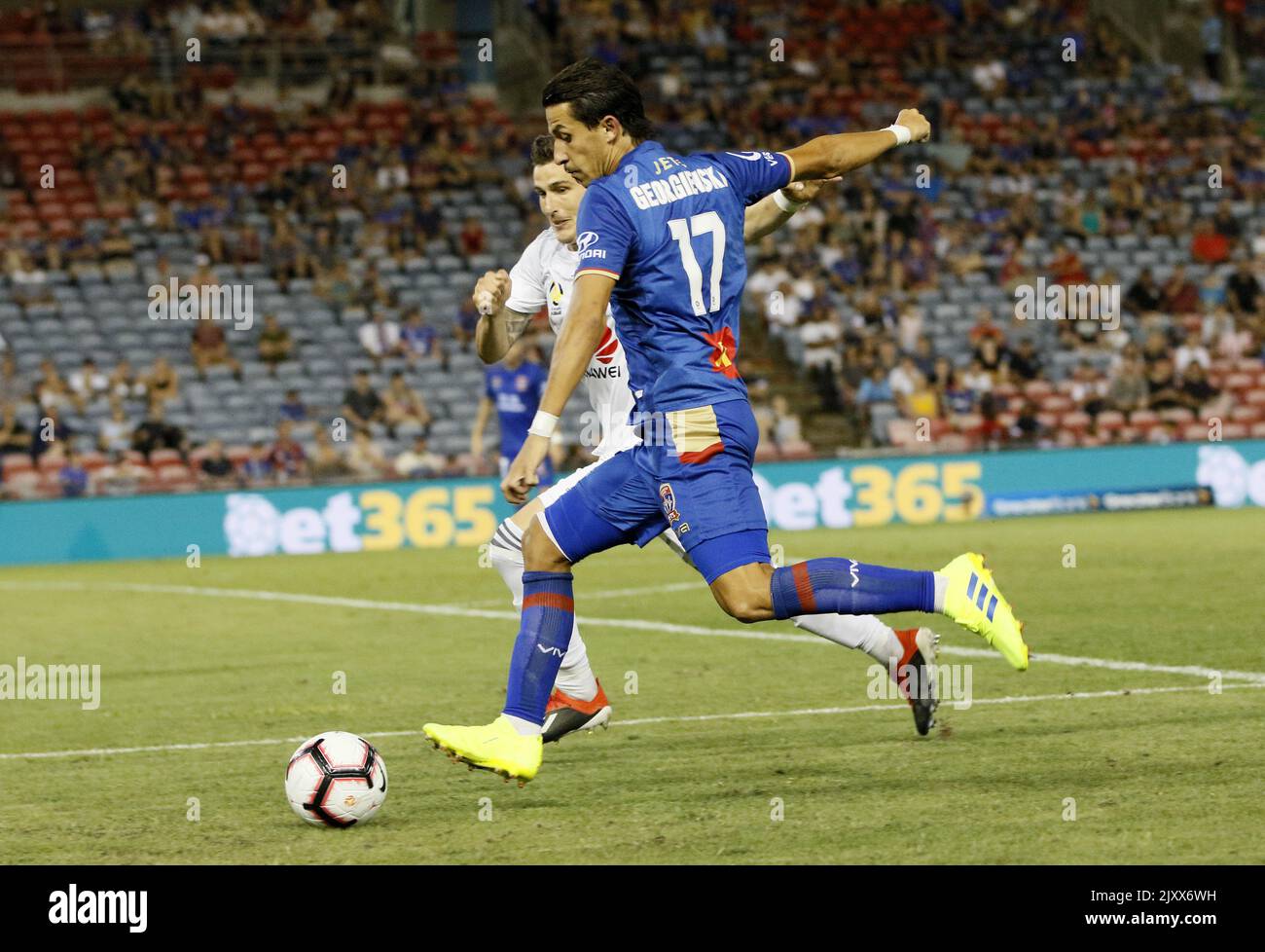 Daniel Georgievski of the Jets puts in a cross during the Round 18 A ...