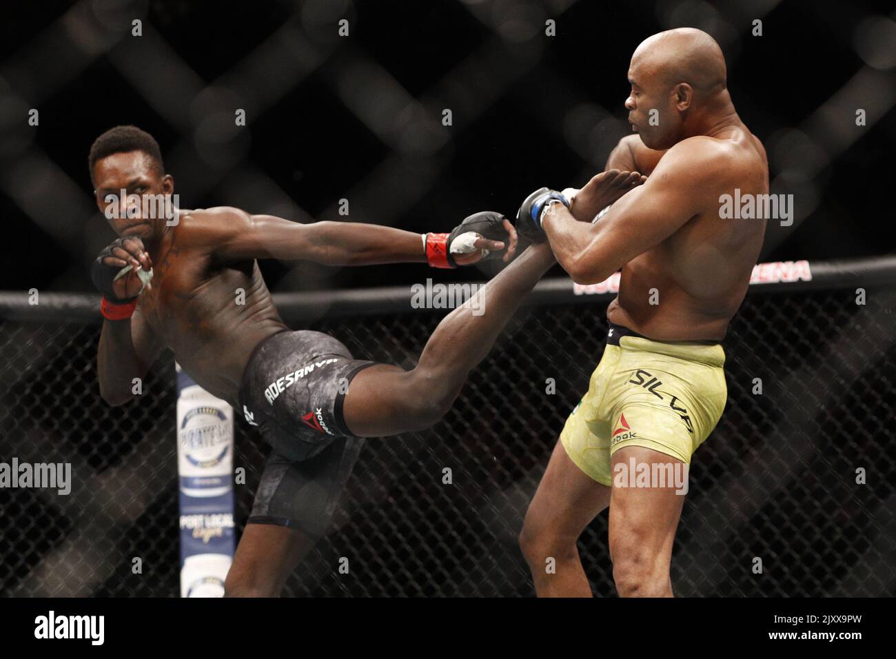 Israel Adesanya (left) kicks during the UFC 234 Middleweight Bout ...