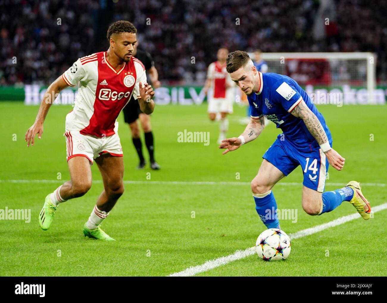 Rangers’ Ryan Kent battles with Ajax’s Devyne Rensch during the UEFA ...