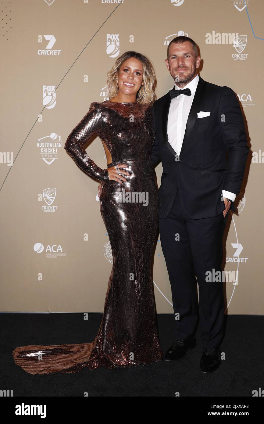 Aaron Finch and Amy Finch pose for a photograph on arrival for the ...