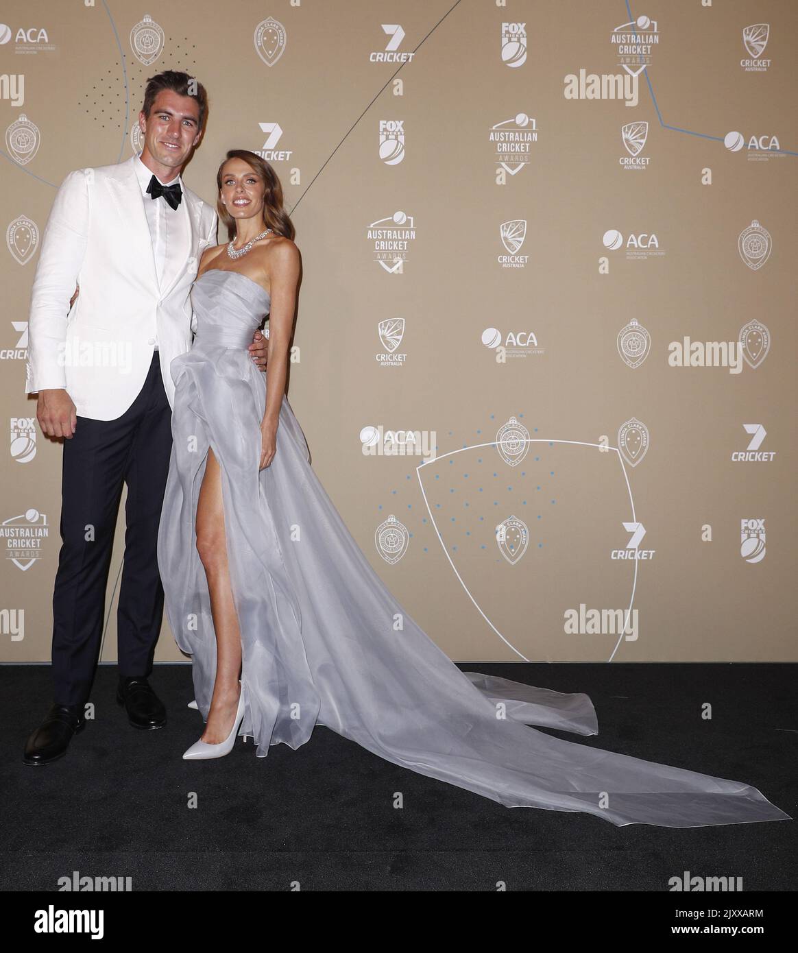 Patrick Cummins and Rebecca Boston pose for a photograph on arrival for ...